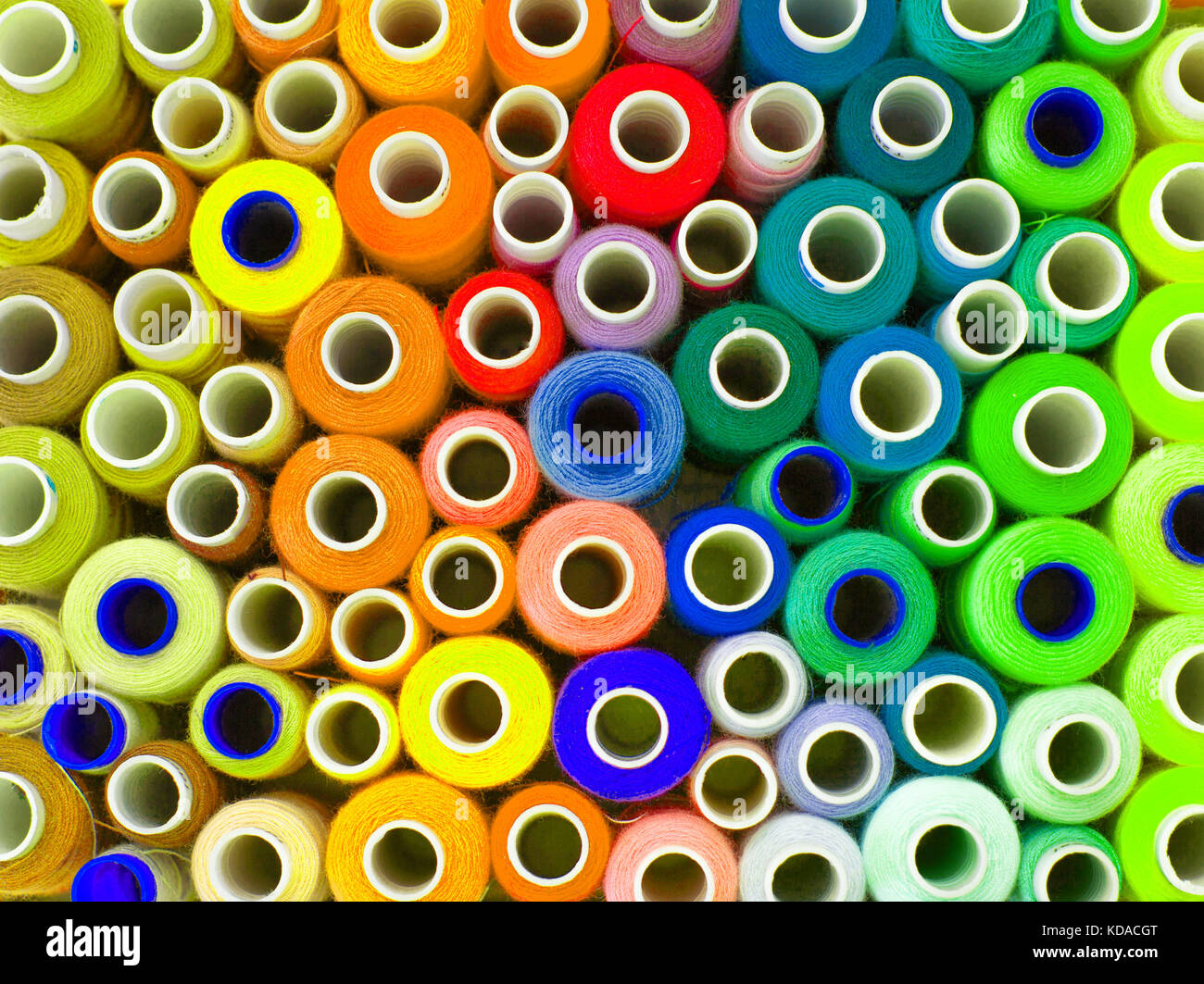 Colored thread for sewing. Threads in spools tape measure, needle bar ...