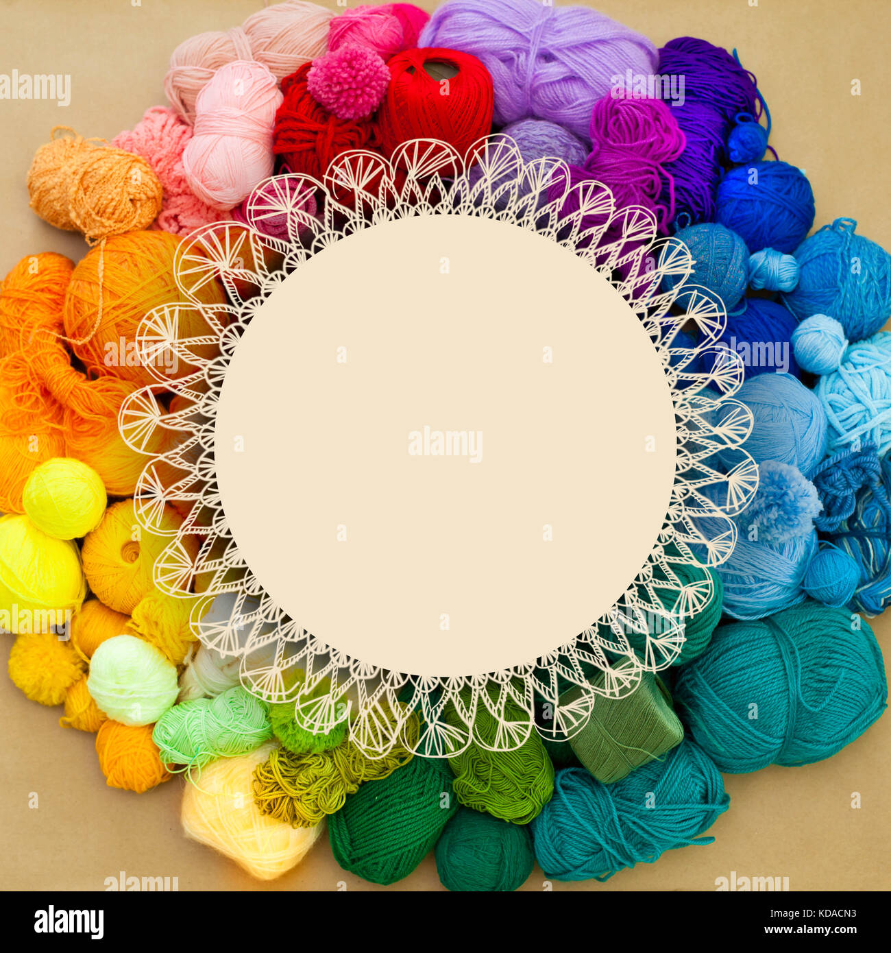 Colorful yarn stacked in a series of colors. Background brown kraft ...