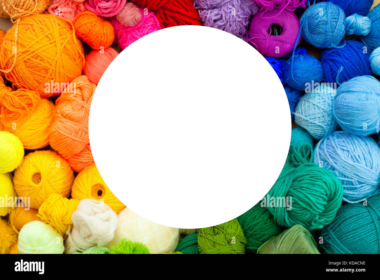 Colorful yarn stacked in a series of colors. Background brown kraft ...