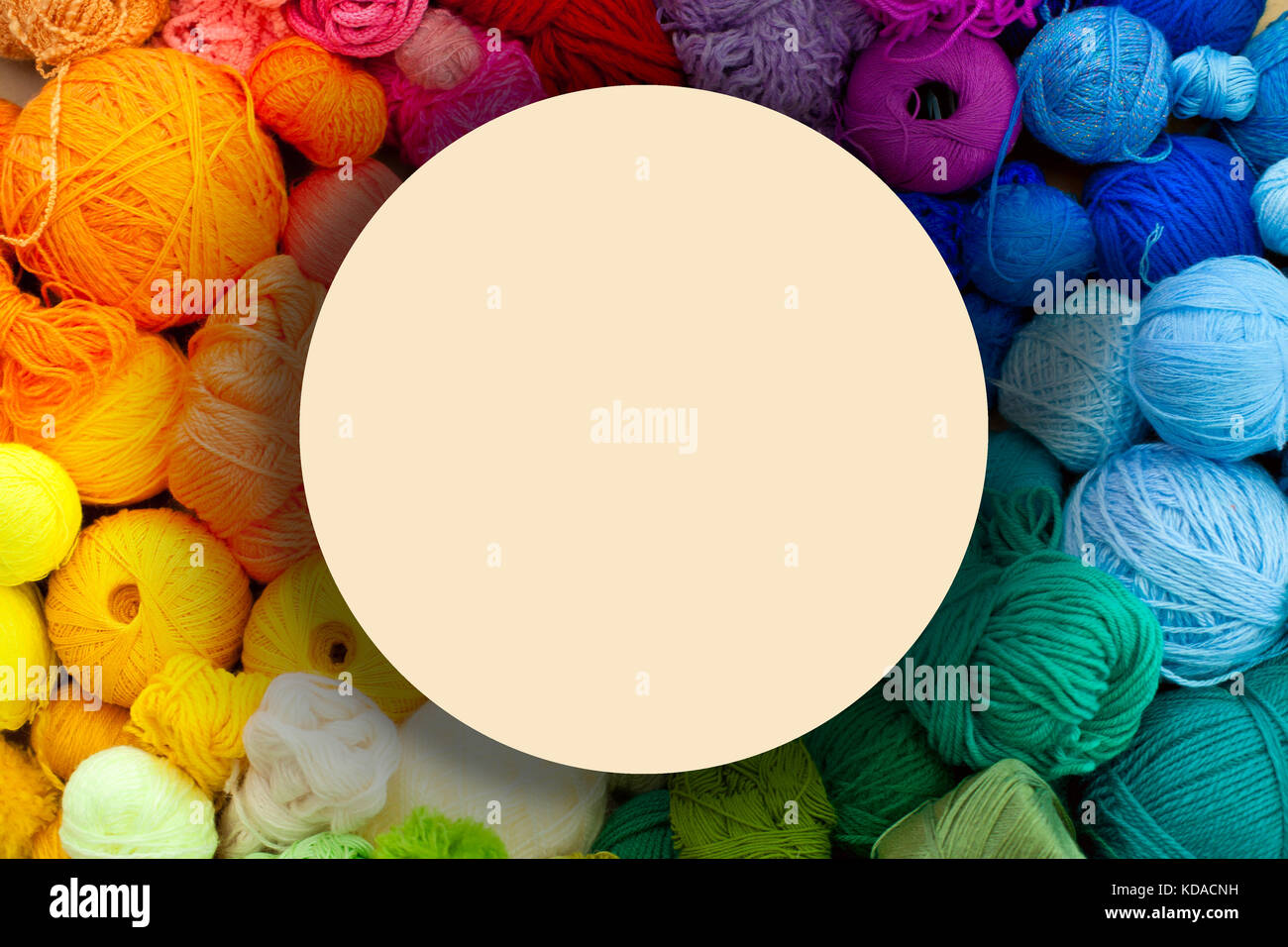 Colorful yarn stacked in a series of colors. Background brown kraft ...