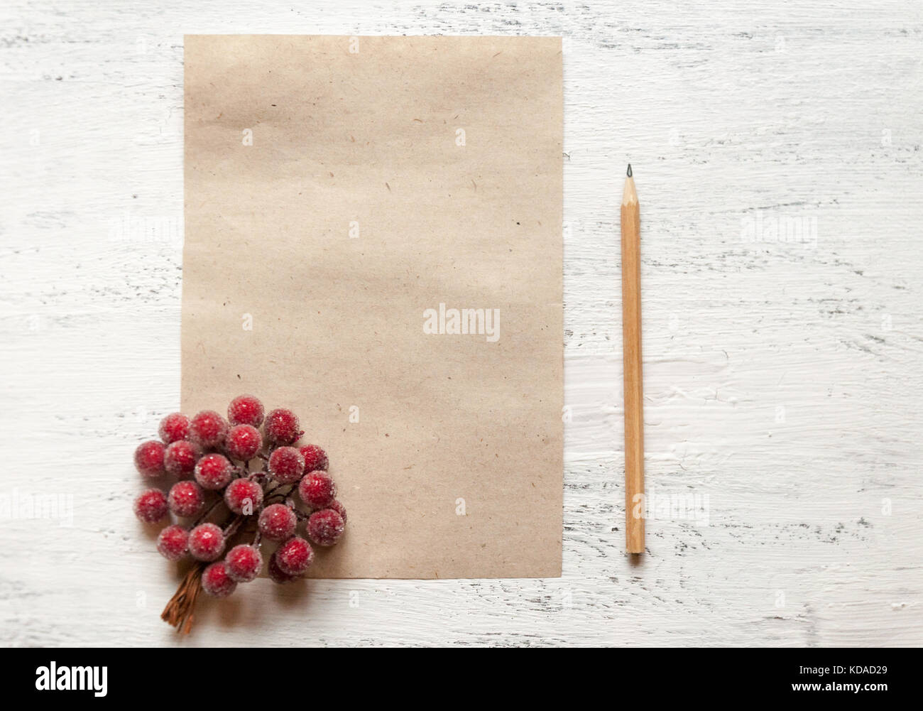 A sheet of paper for notes or sketches and a pencil. Toning and blur ...