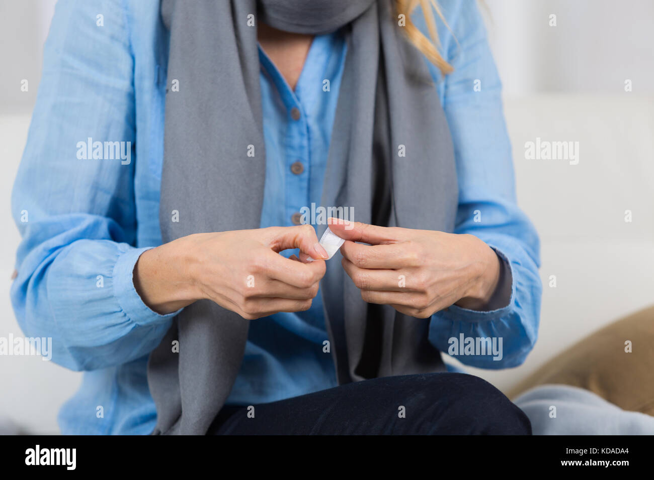 mature woman put plaster bandage on finger cut Stock Photo - Alamy