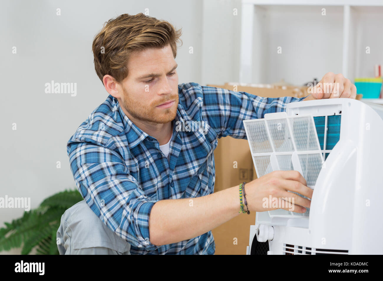 repairman fixing electronic devices Stock Photo - Alamy