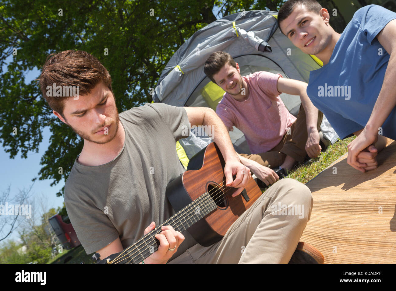 camping friends having fun Stock Photo - Alamy