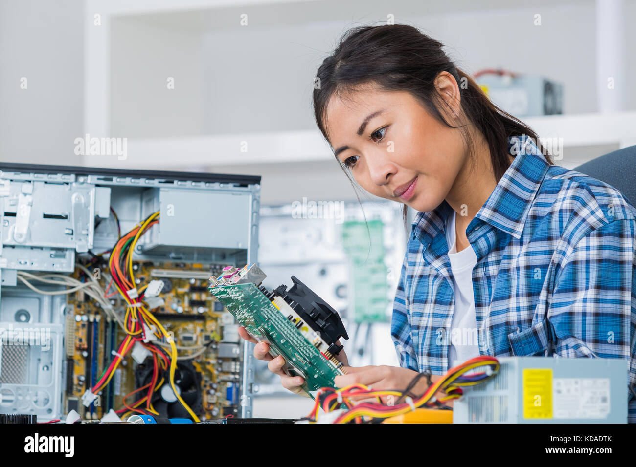 female pc technician posing next to a disassembled desktop Stock Photo ...