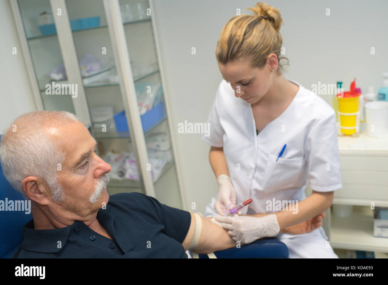 nurse giving injection to senior man Stock Photo - Alamy