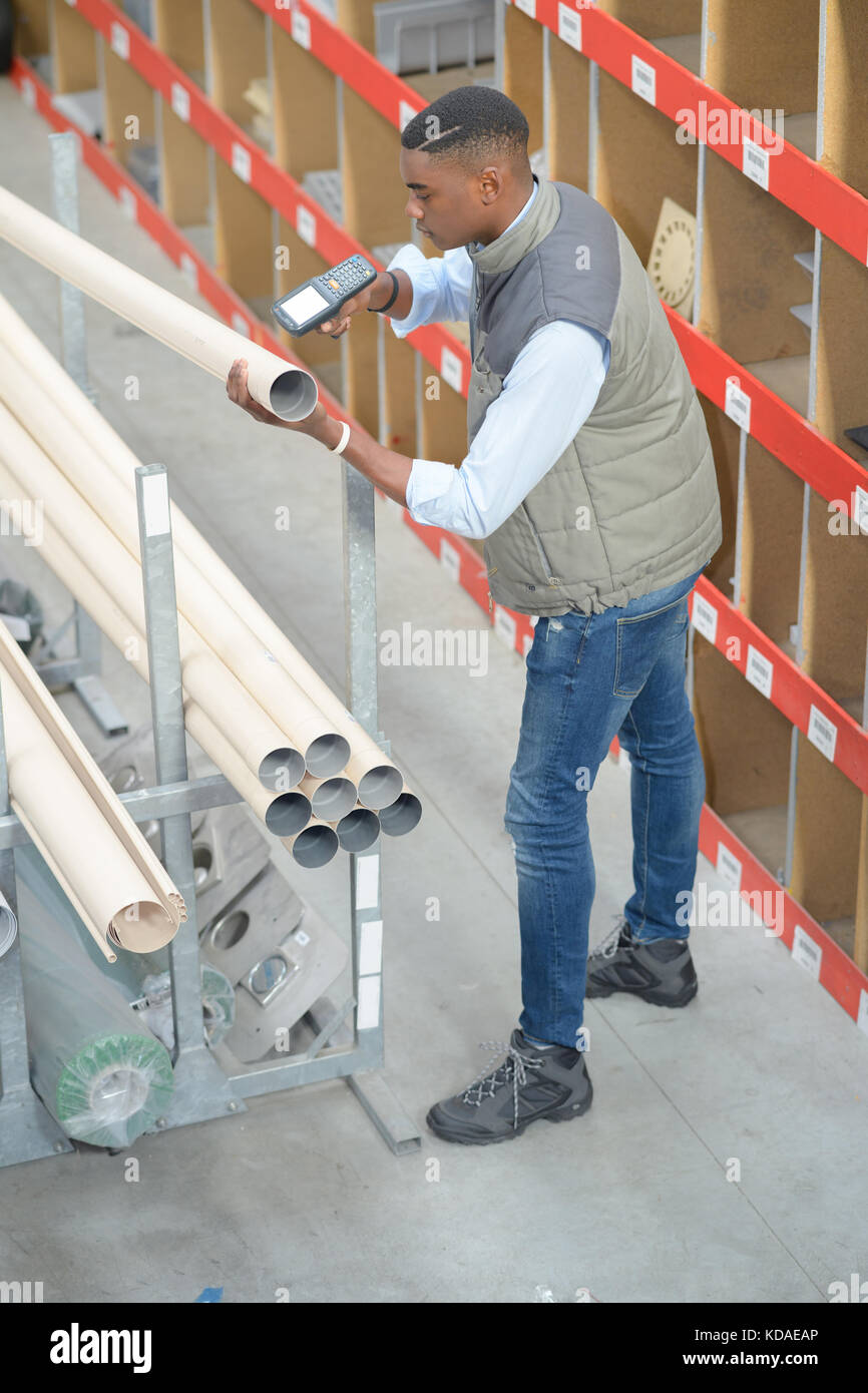 worker scanning the bar code Stock Photo - Alamy