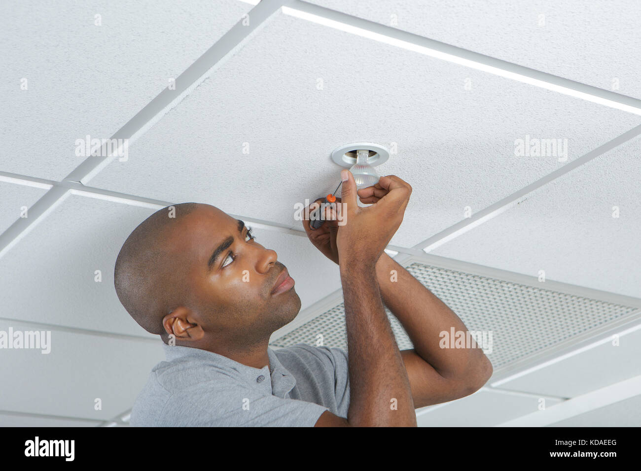 fixing the light bulb Stock Photo - Alamy