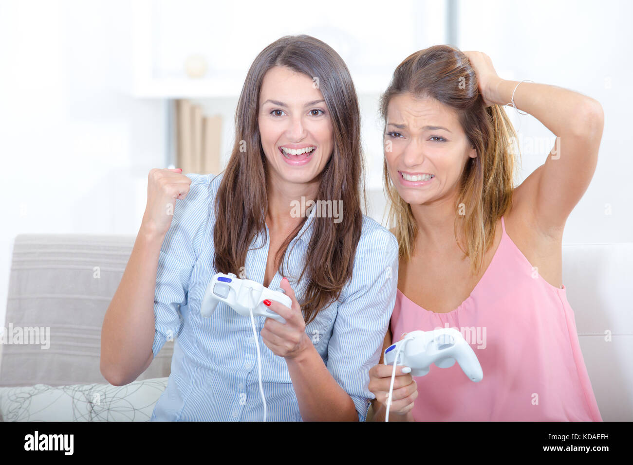girls playing video game Stock Photo - Alamy