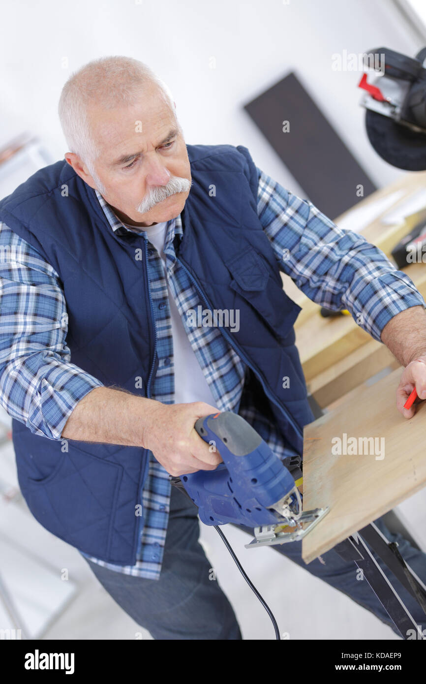 man using a band saw Stock Photo - Alamy