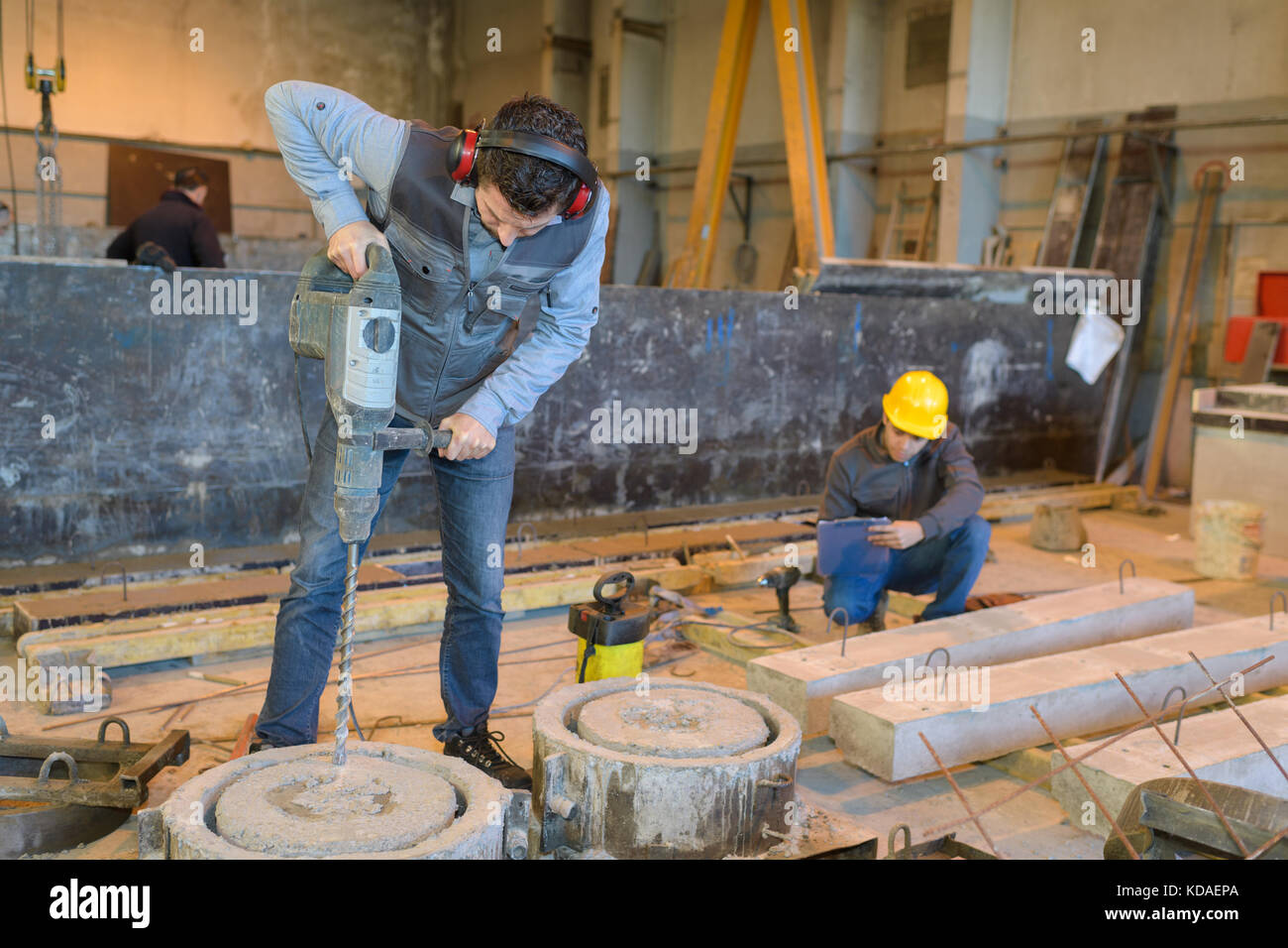 working with concrete in a warehouse Stock Photo - Alamy