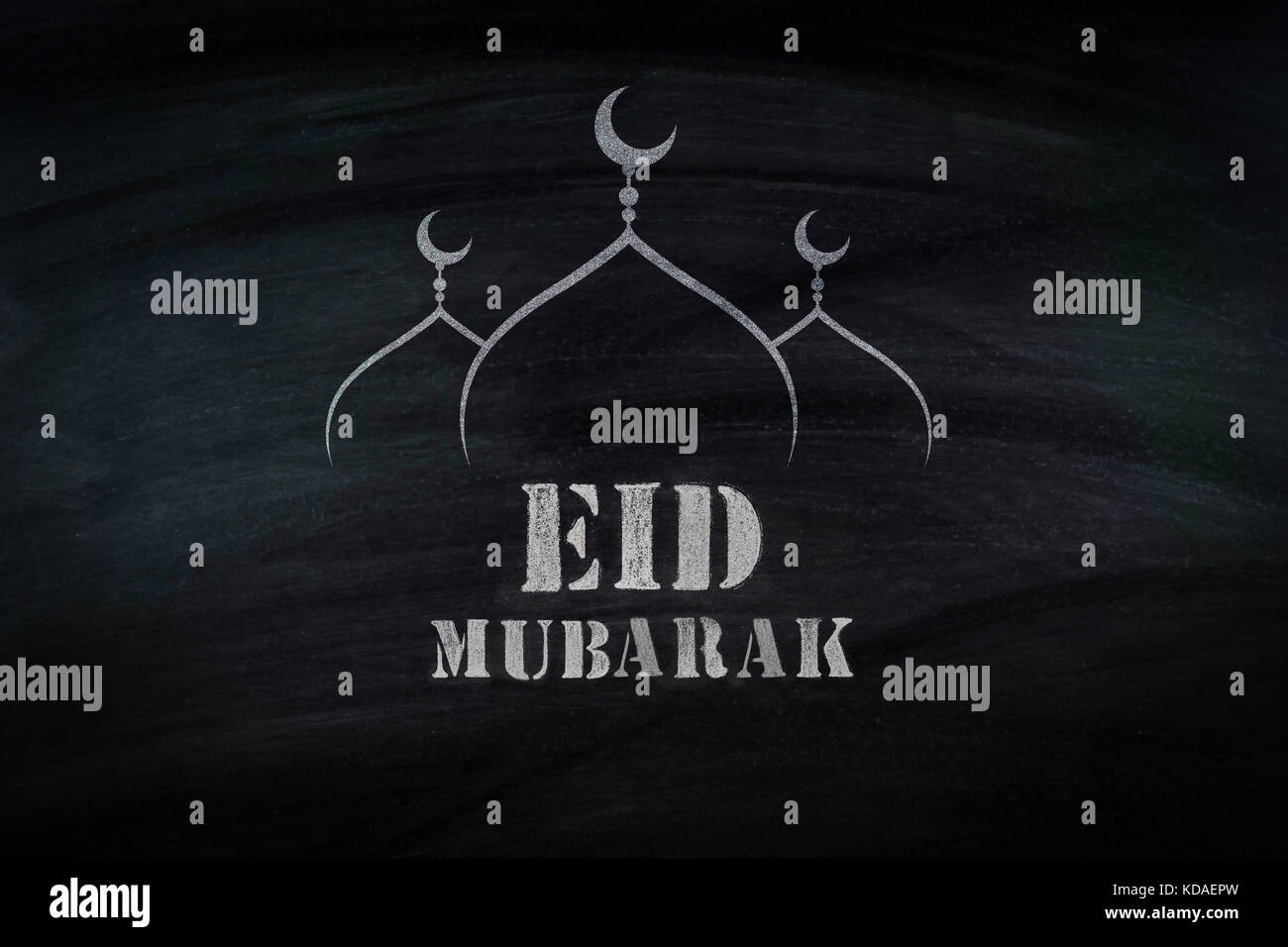 Eid Mubarak, traditional Muslim greeting . On blackbroad Stock Photo ...
