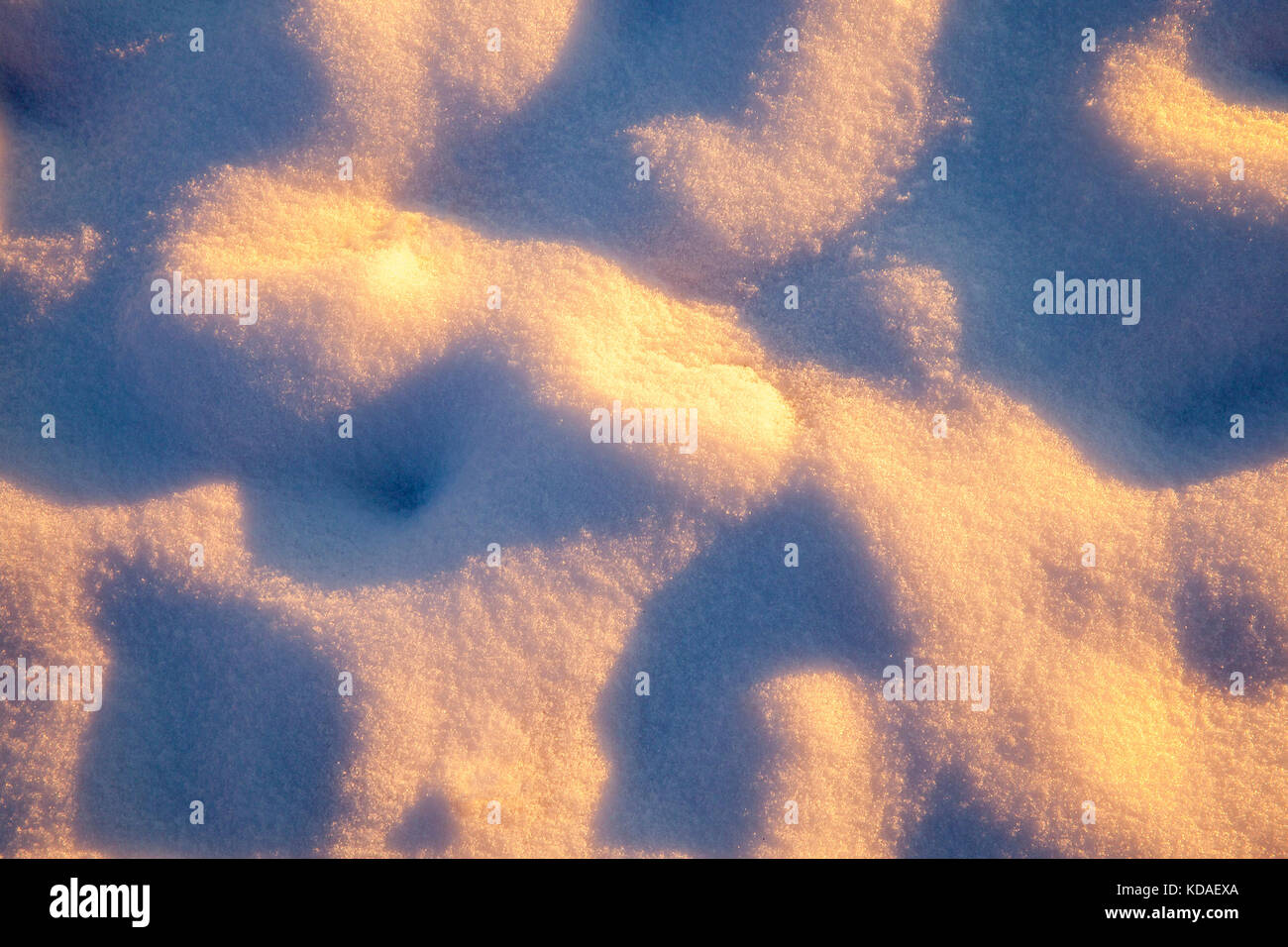 Snow at sunset Stock Photo - Alamy