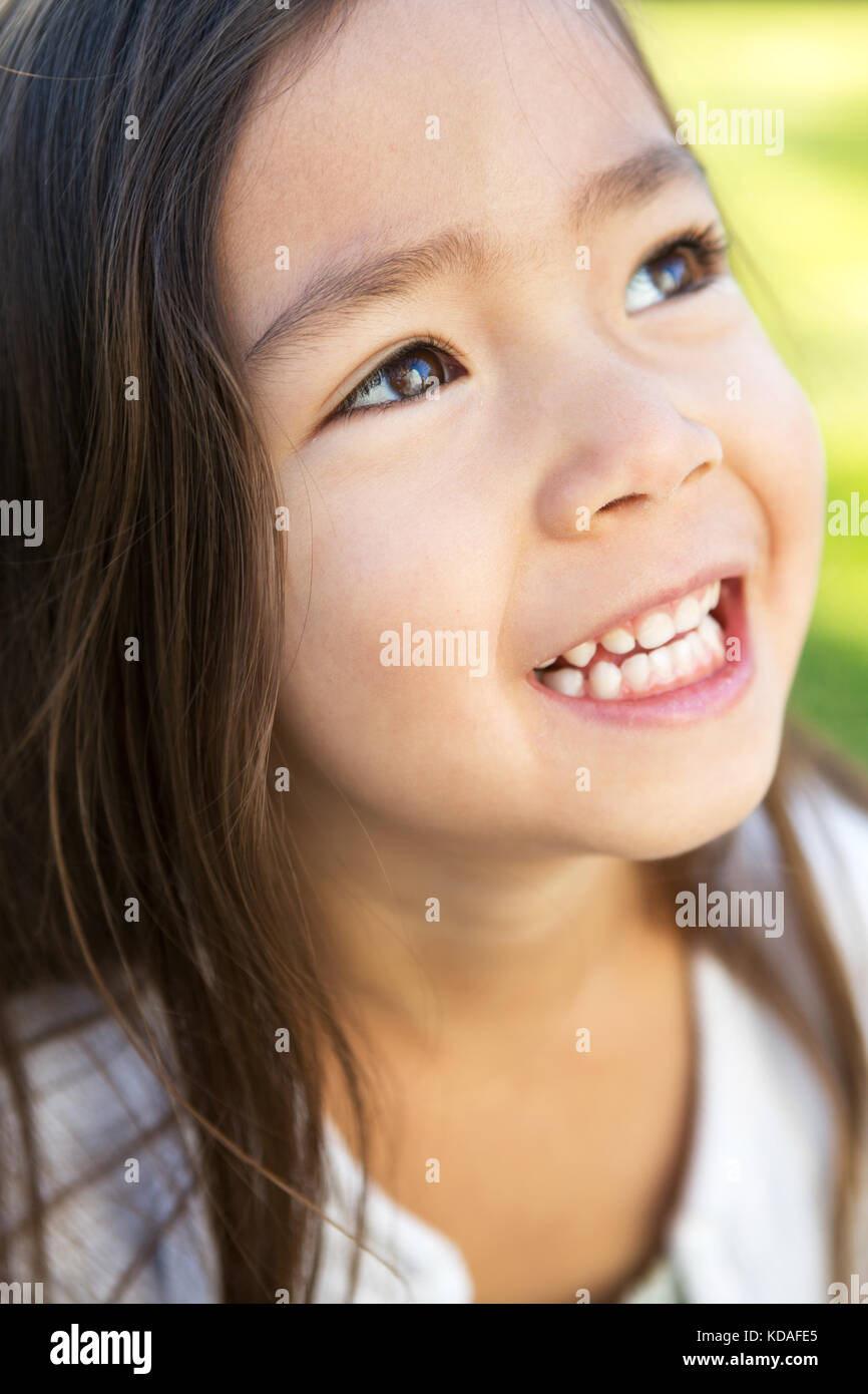 Cute little girl smiling and happy Stock Photo - Alamy