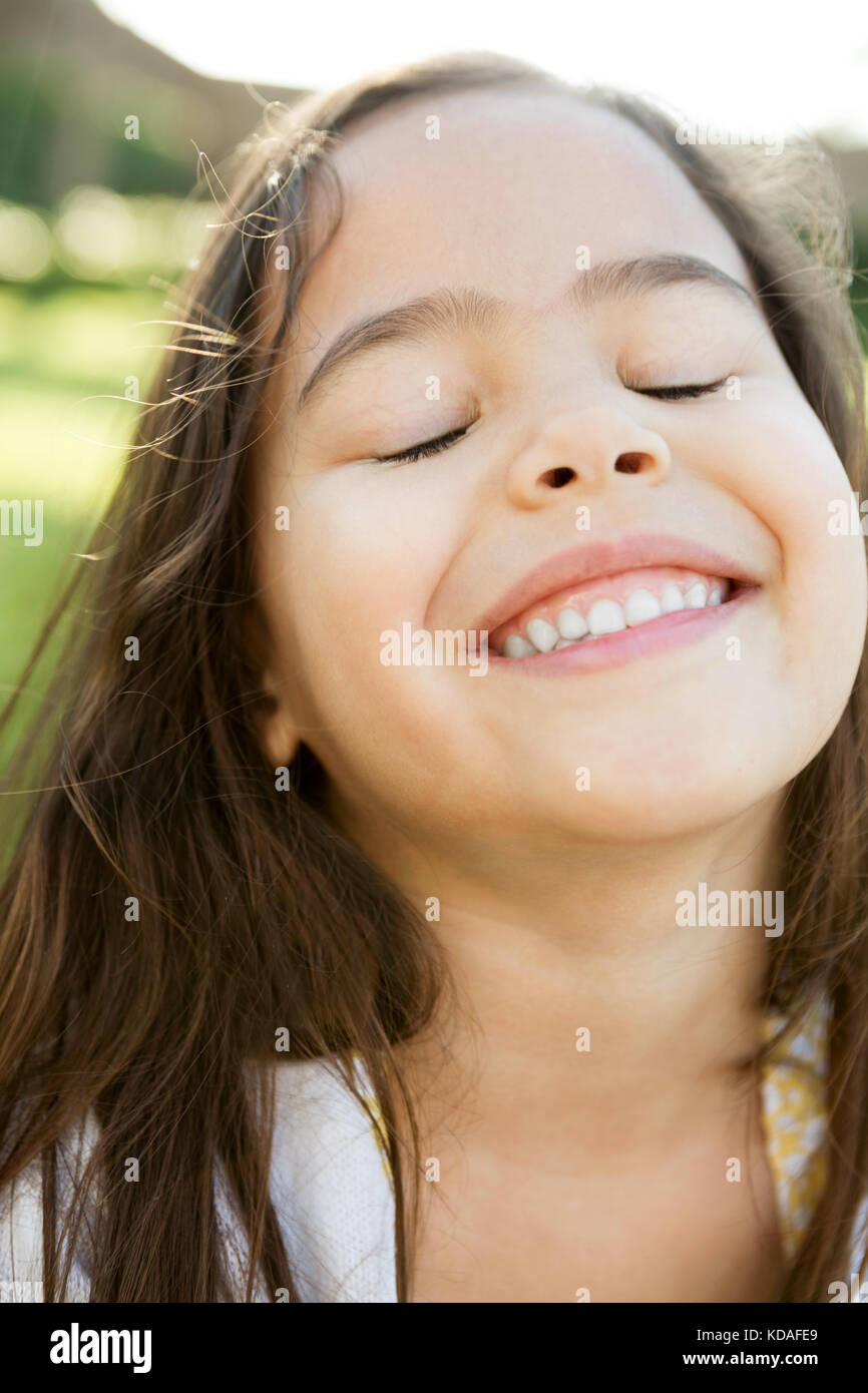 Cute little girl smiling and happy Stock Photo - Alamy