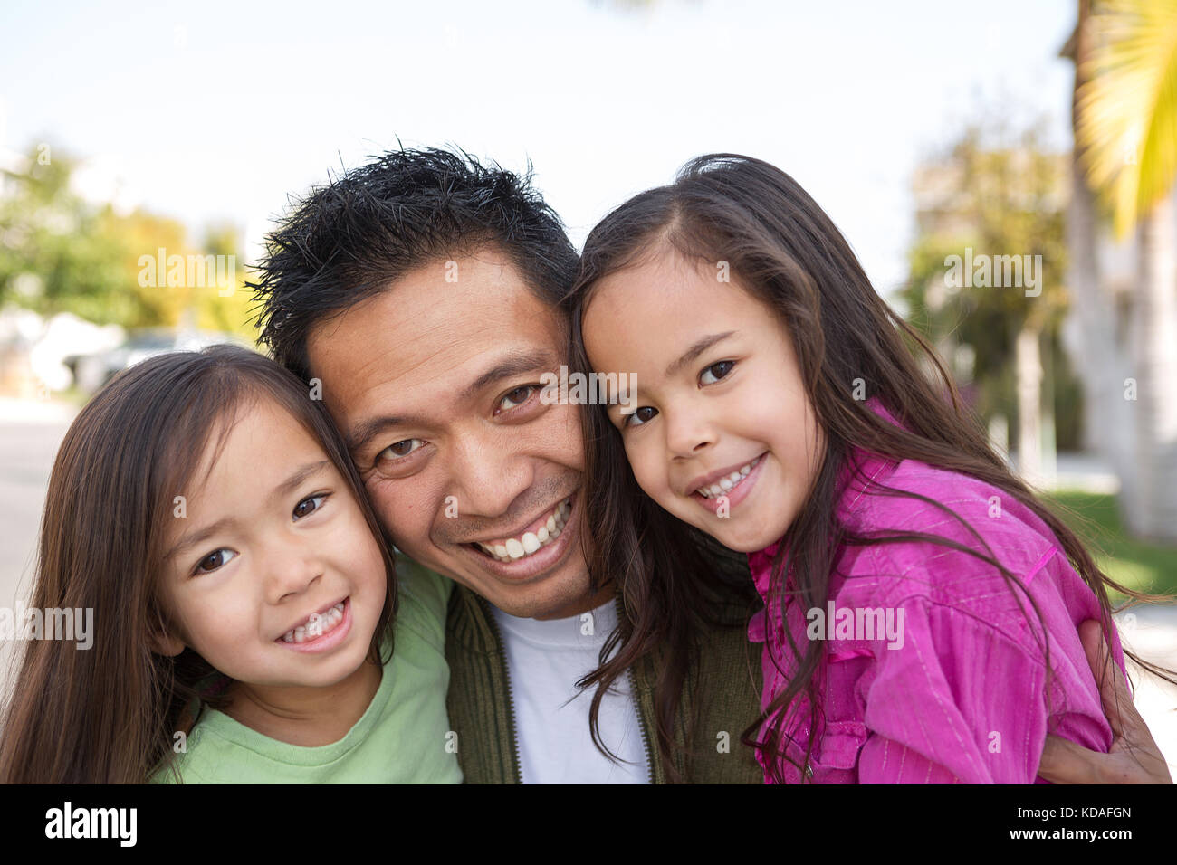 Asian father with his daughter Stock Photo - Alamy