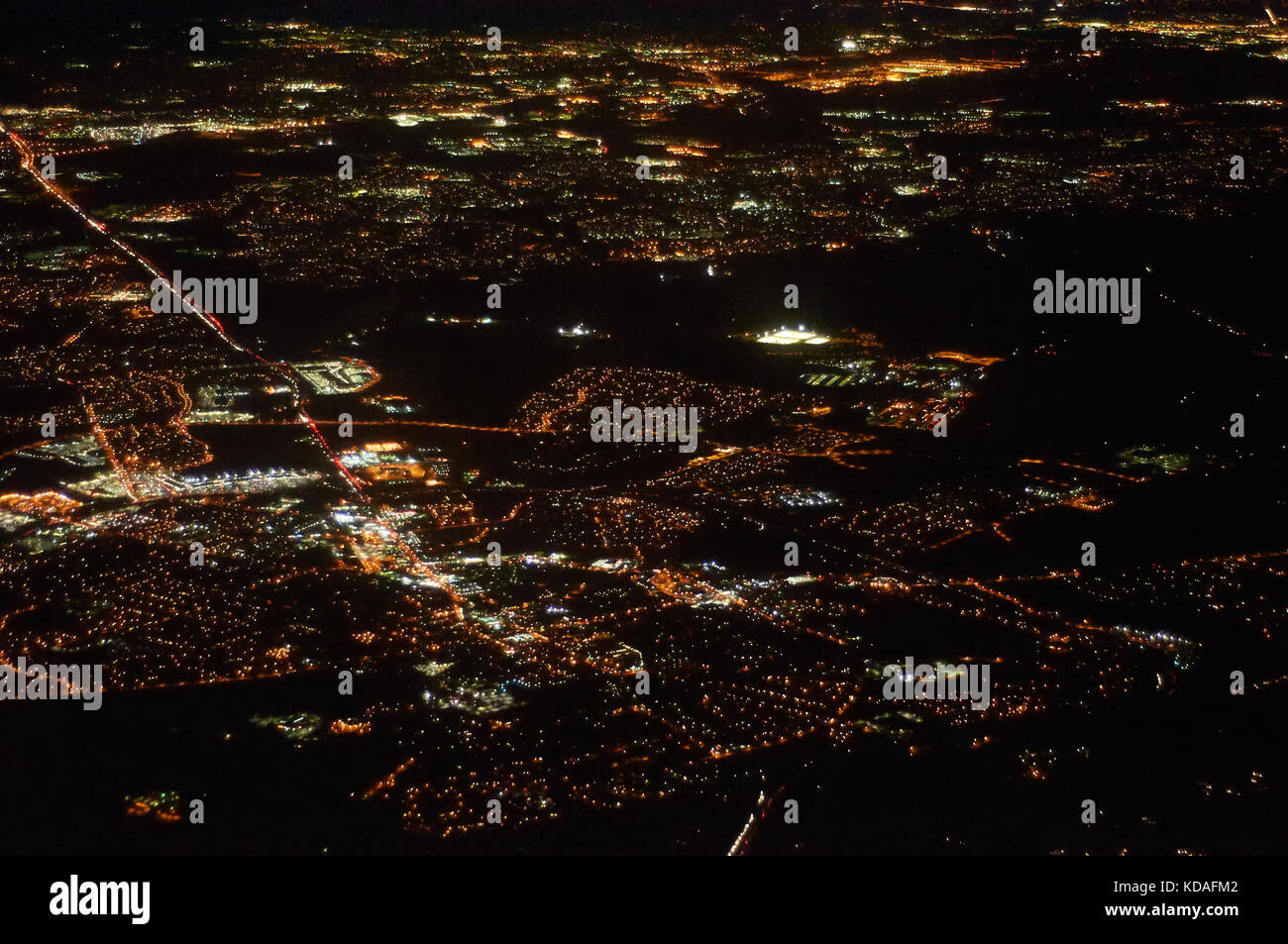 Night view of city from airplane illuminator flying high Stock Photo ...