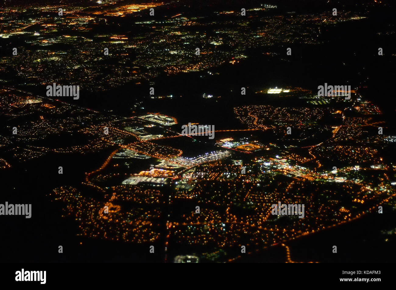 Night view of city from airplane illuminator flying high Stock Photo ...