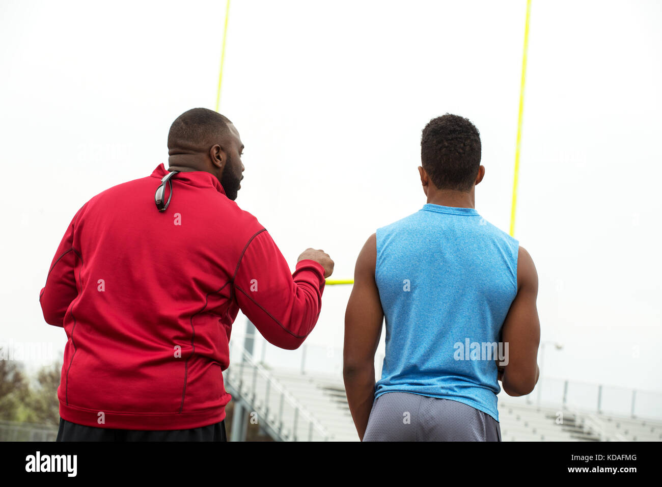 Coach training a high school athlete Stock Photo - Alamy