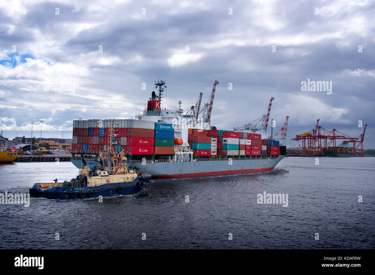 Container ship in Swan River arriving Fremantle port with assistance of ...