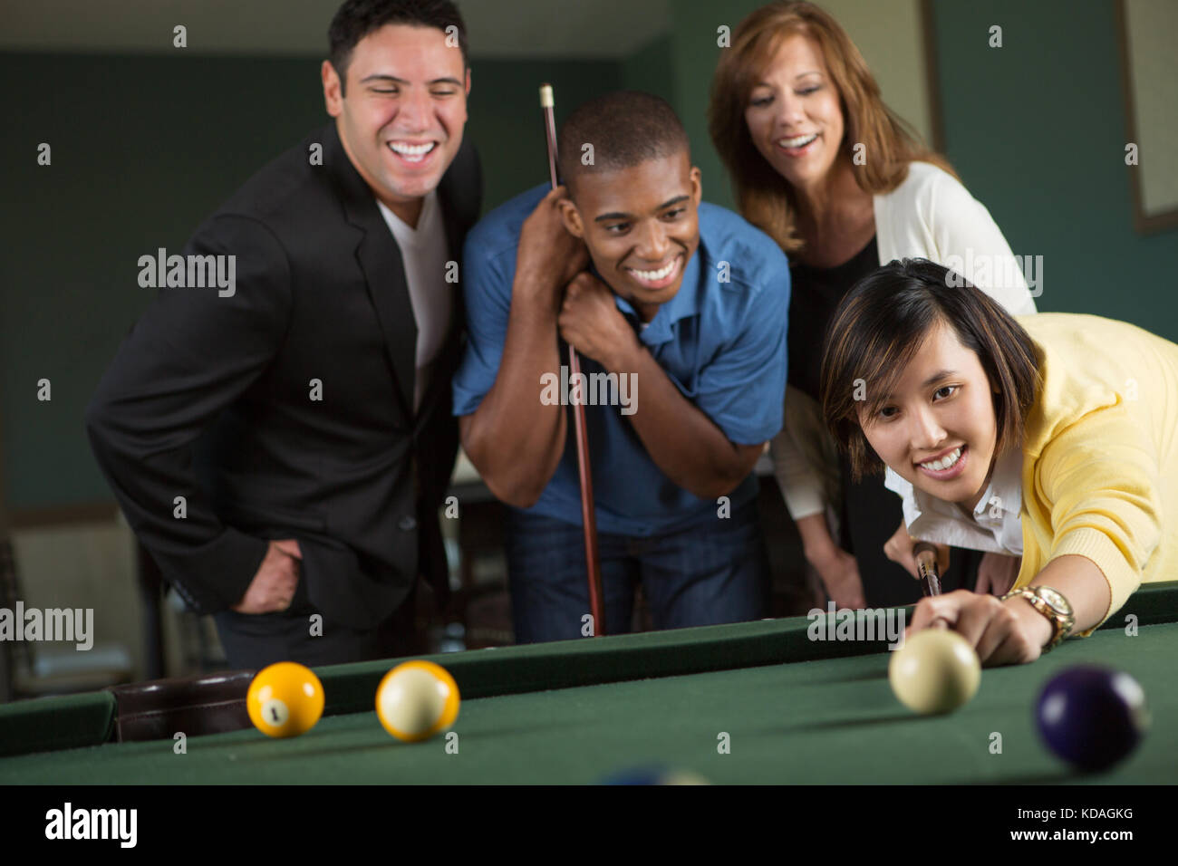 Diverse group of people playing pool Stock Photo - Alamy