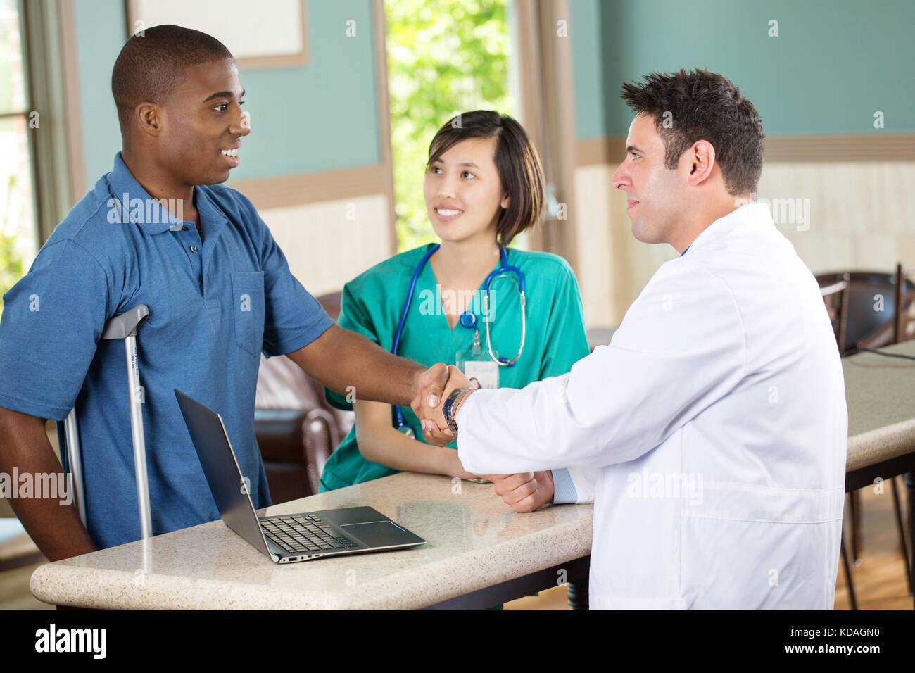 Medical team talking with patients Stock Photo - Alamy