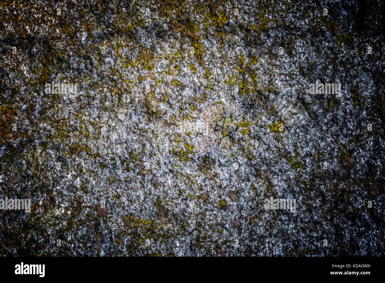 Natural hard rock or stone texture surface as background. Darken from ...