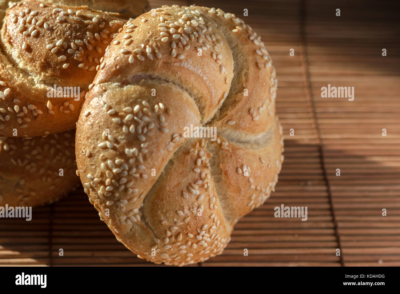 Bread buns with sesame seeds, side view, close up Stock Photo - Alamy