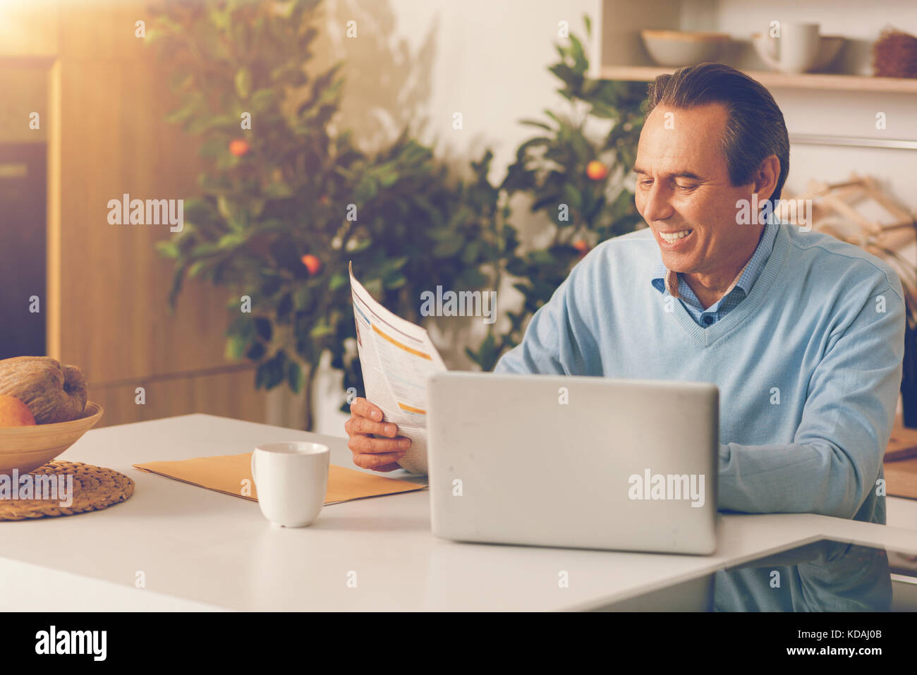 Man laptop home tea newspaper hi-res stock photography and images - Alamy