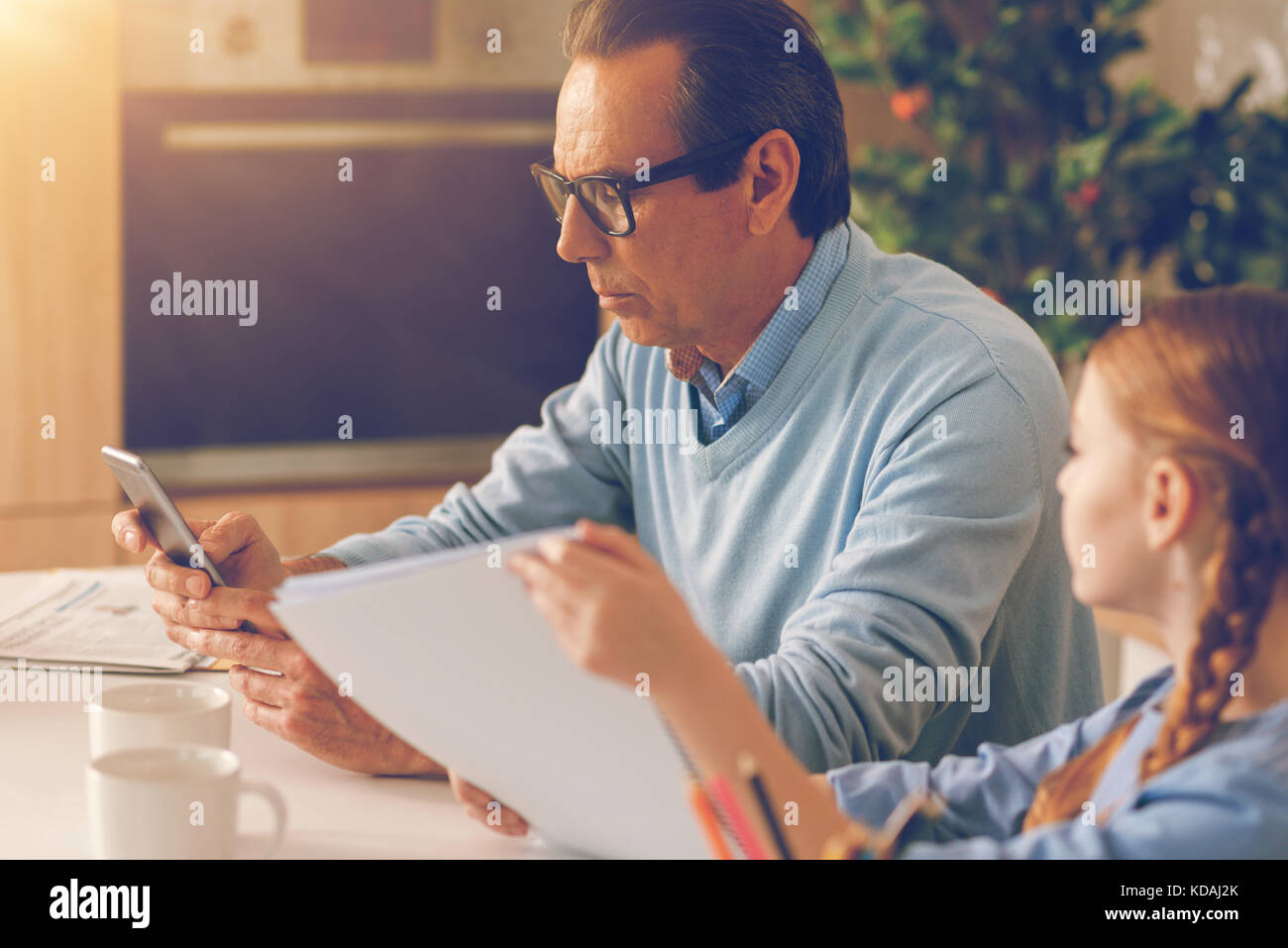 Side view on busy father ignoring his child at home Stock Photo - Alamy
