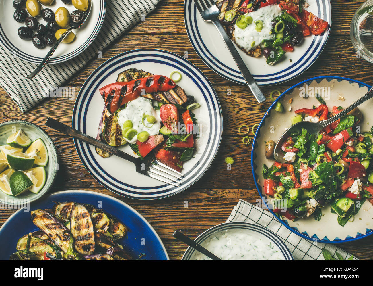 Flat-lay of healthy dinner table setting with green salad Stock Photo ...
