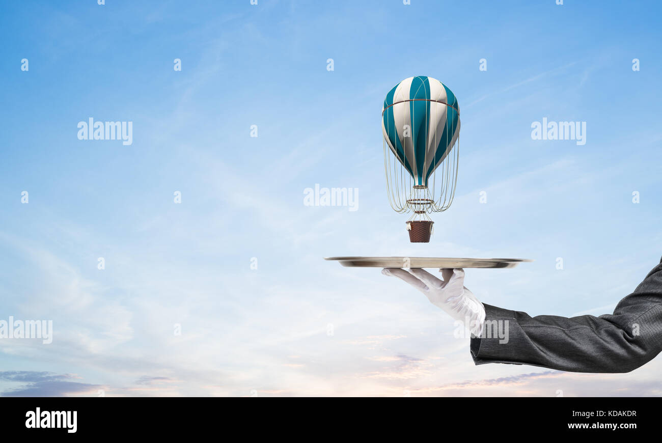 Hand of waiter presenting balloon on tray Stock Photo - Alamy