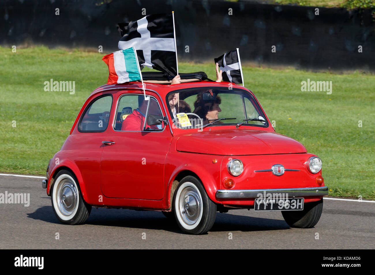 The flag waving classic Fiat 500 is celebrated in an Italian cavalcade ...