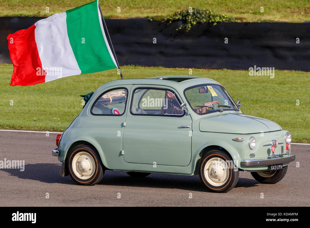 The flag waving classic Fiat 500 is celebrated in an Italian cavalcade ...