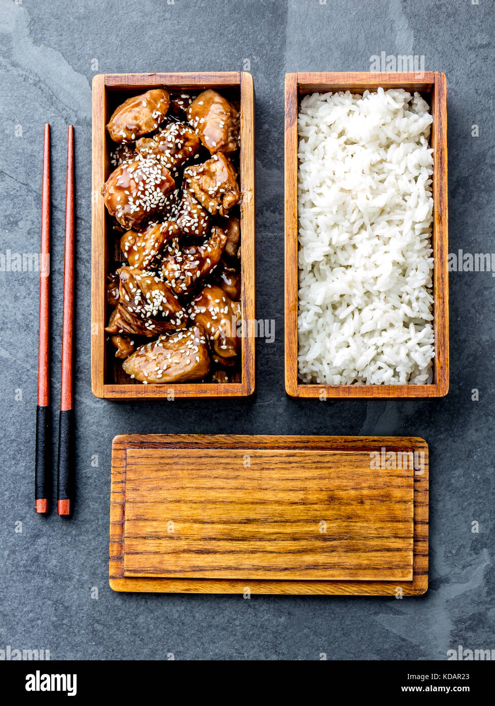 Japanese food. Chicken teriyaki with rice in wooden bento lunch box ...