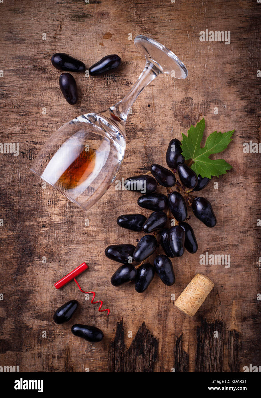 Grapes, red wine, glass, corkscrews and cork Stock Photo - Alamy