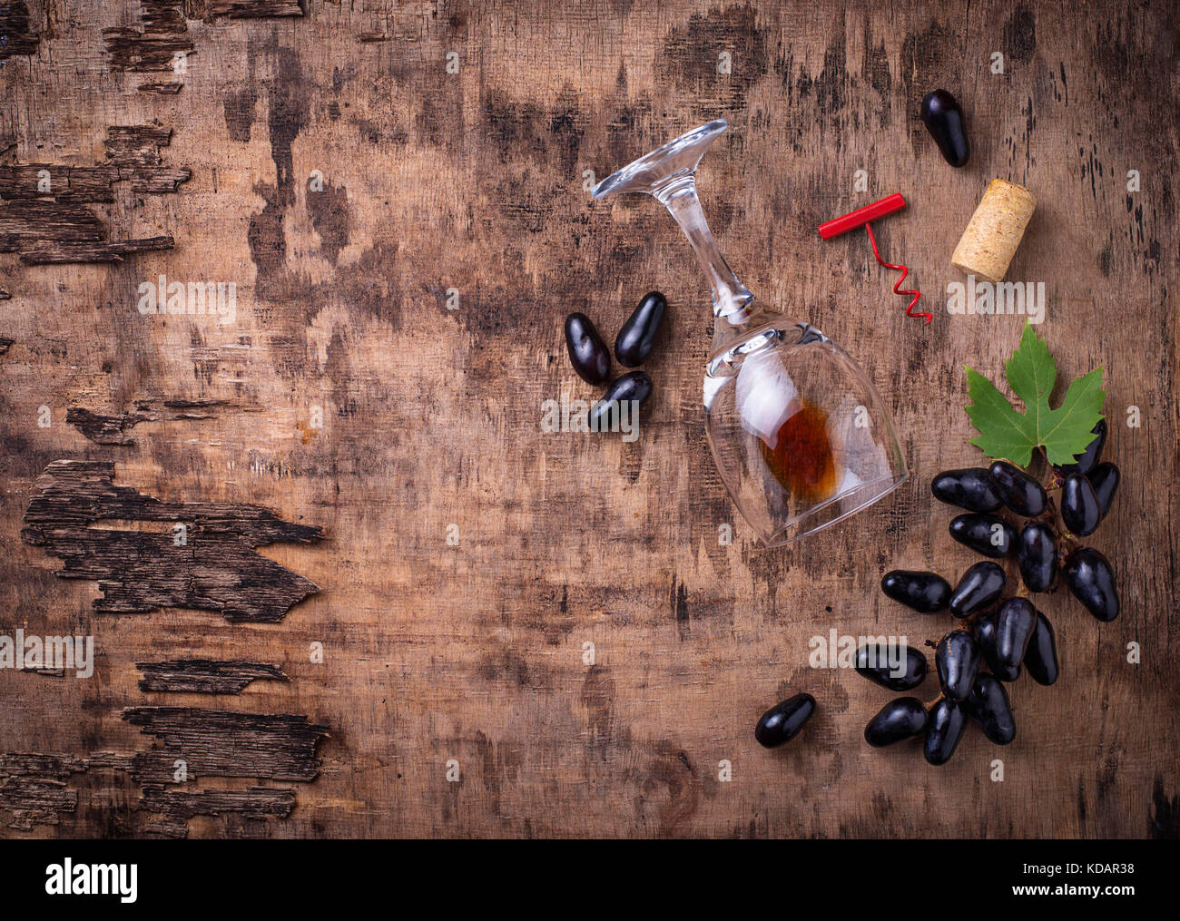 Grapes, red wine, glass, corkscrews and cork Stock Photo - Alamy