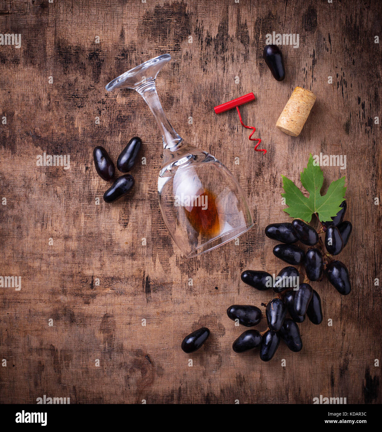 Grapes, red wine, glass, corkscrews and cork Stock Photo - Alamy