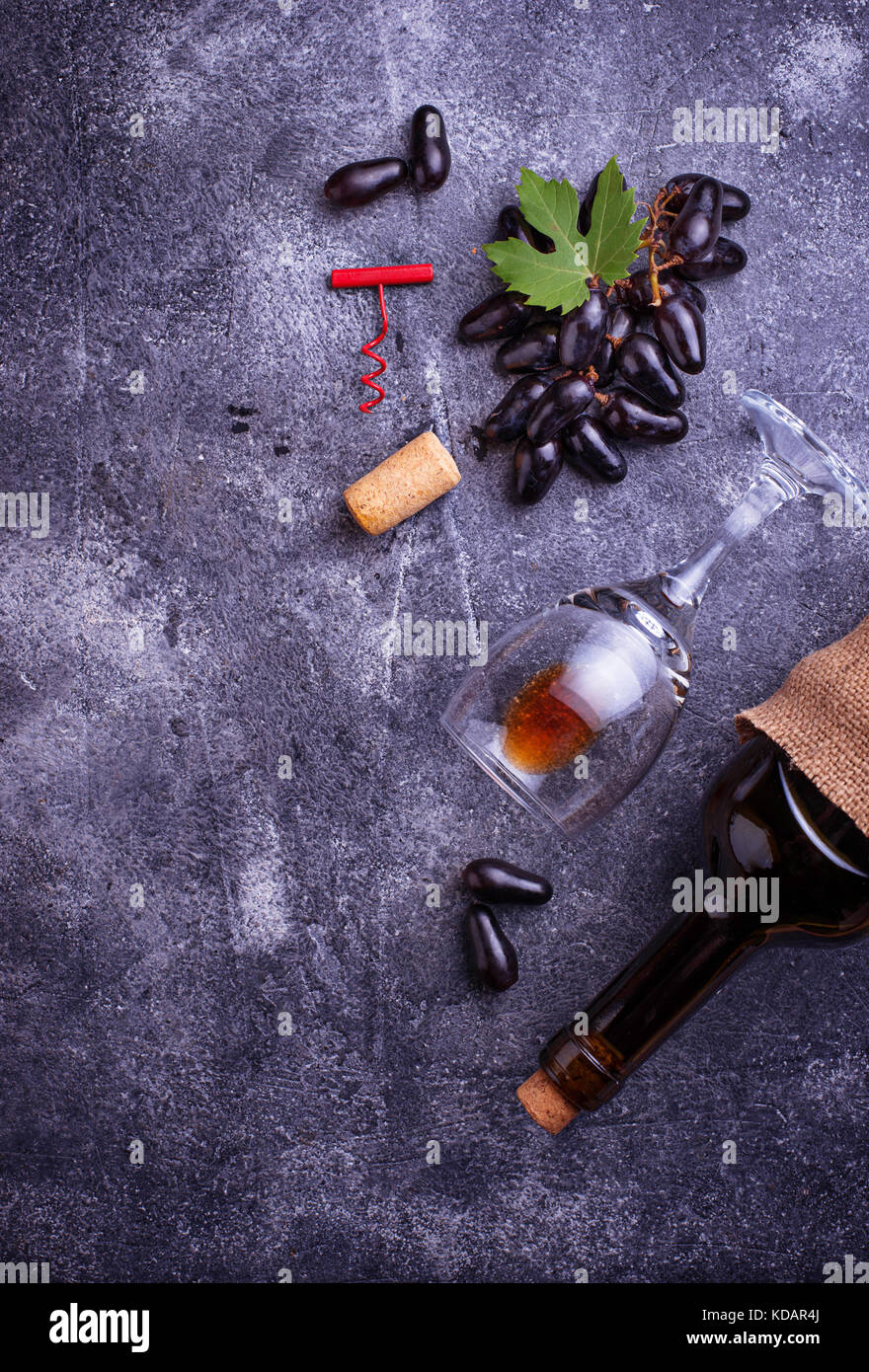 Grapes, red wine, glass, corkscrews and cork Stock Photo - Alamy