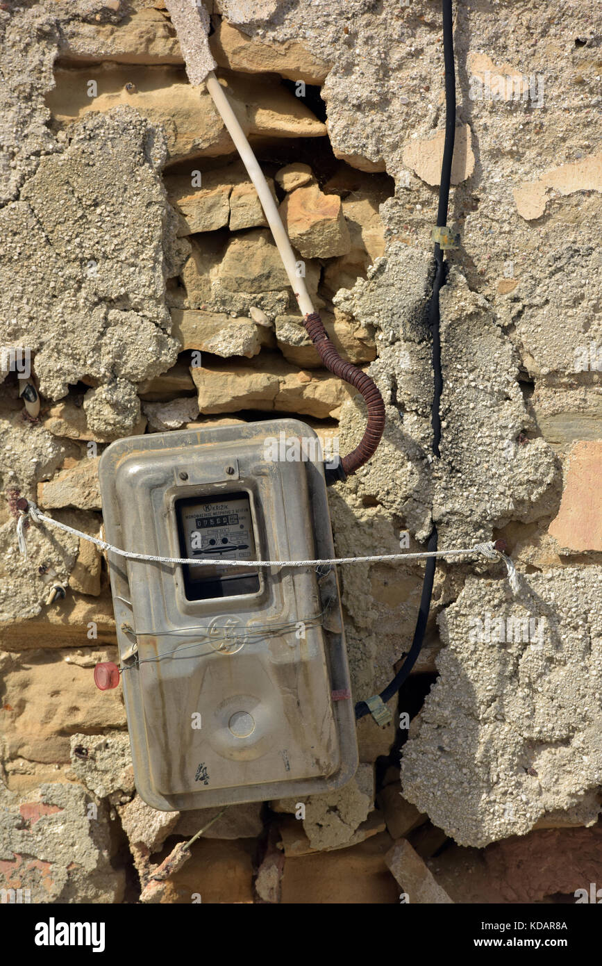 electricity and gas meters badly installed in an unsafe way on houses ...