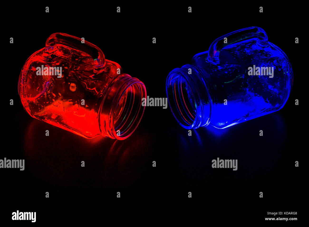 Red and blue fluorescent glass jars Stock Photo - Alamy