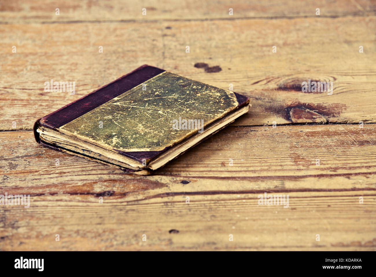Beautiful old book on the wooden floor Stock Photo - Alamy