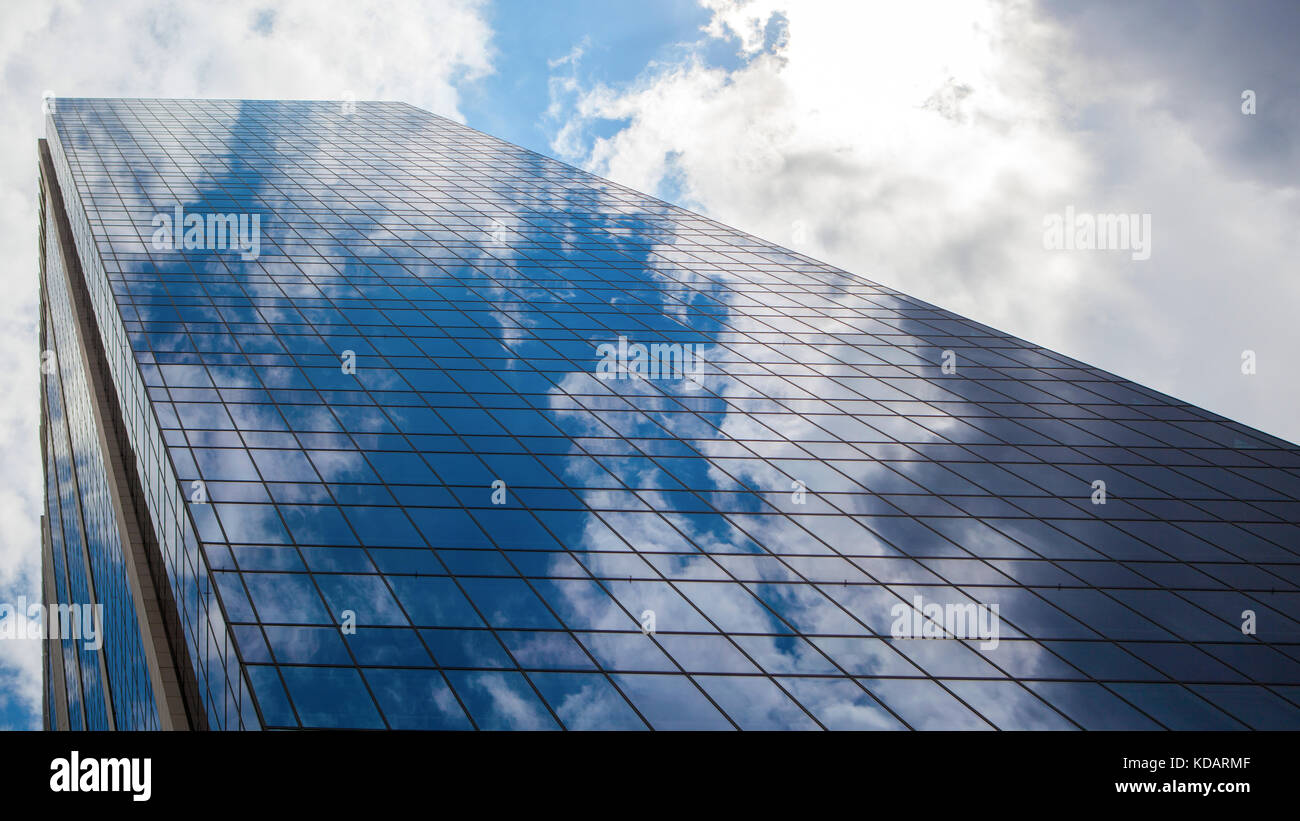 Blue office building with clouds reflection Stock Photo - Alamy