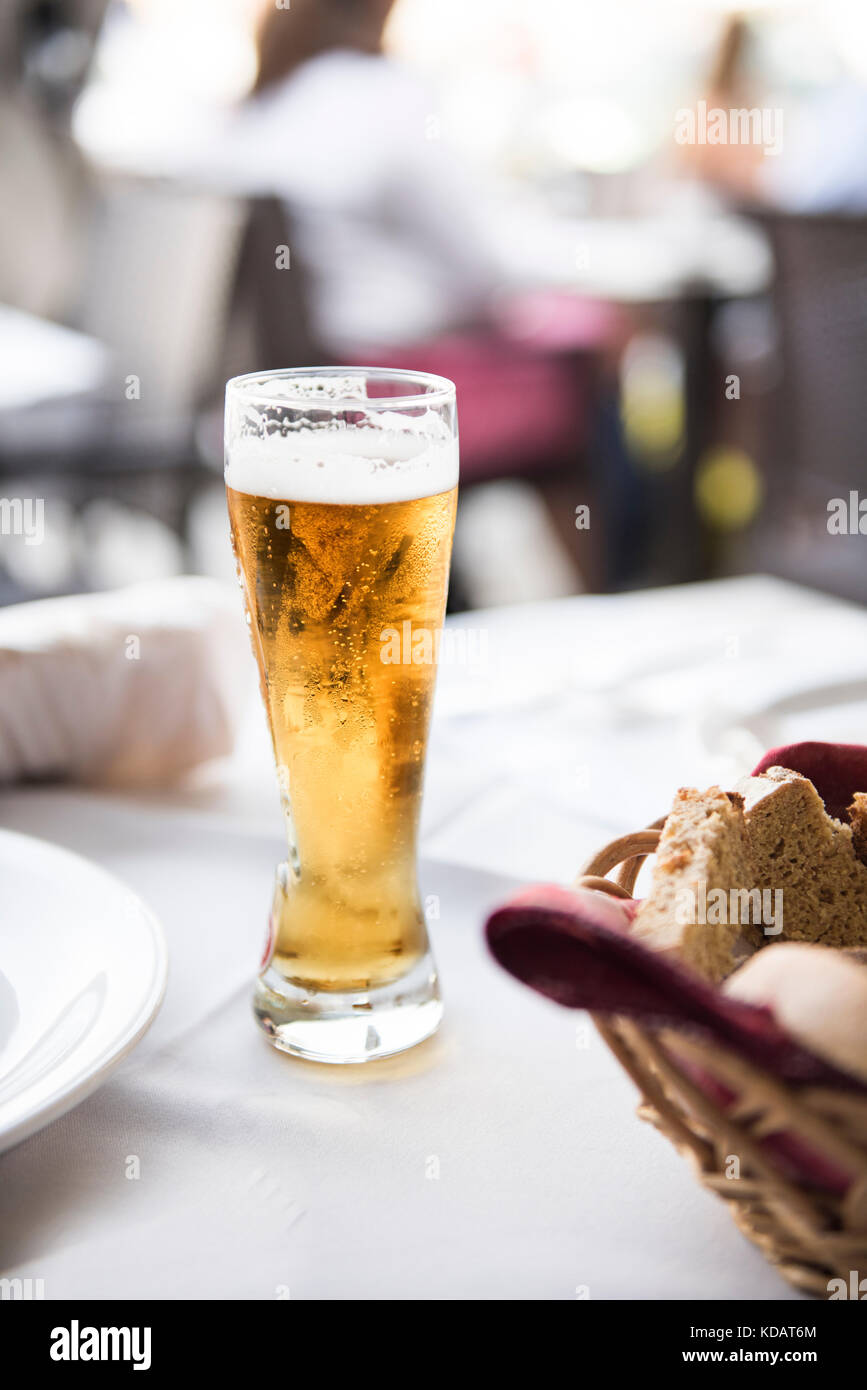 Glass of beer on a table at lunch Stock Photo - Alamy