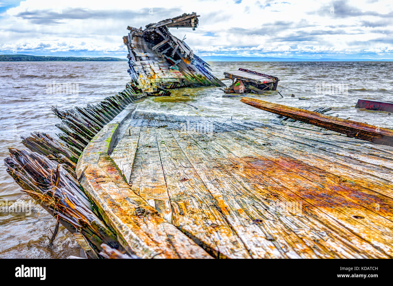 Baie-Saint-Paul in Quebec, Canada shipwreck in water with waves with ...