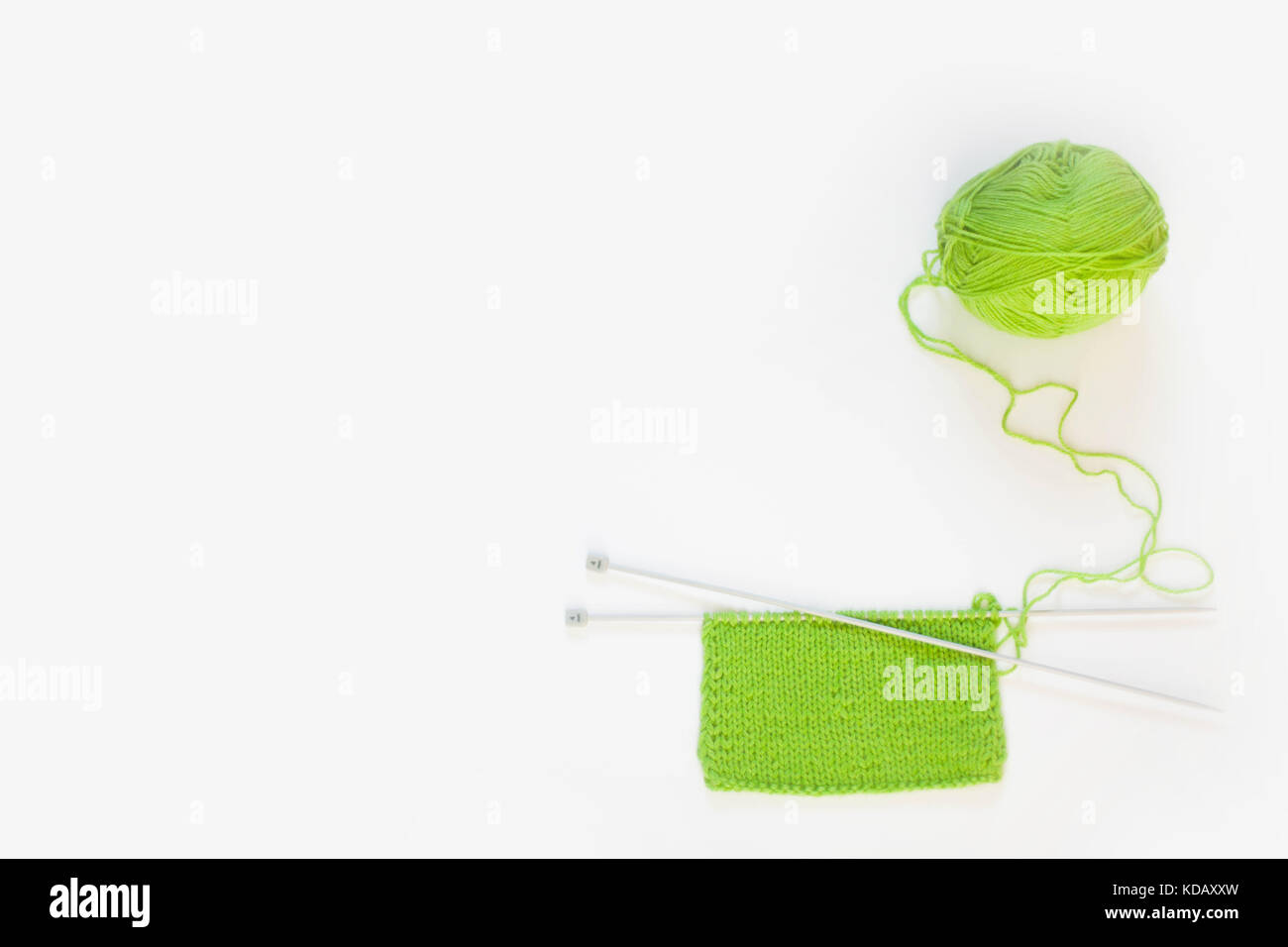 Knitted knitted green. Yarn for knitting green. White background Stock ...