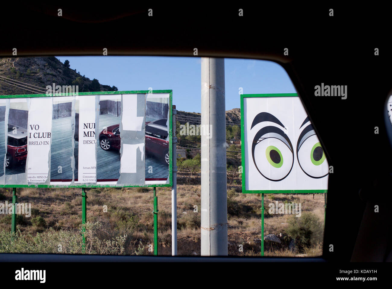 Funny advertising boards on the roadside in Spain Stock Photo - Alamy