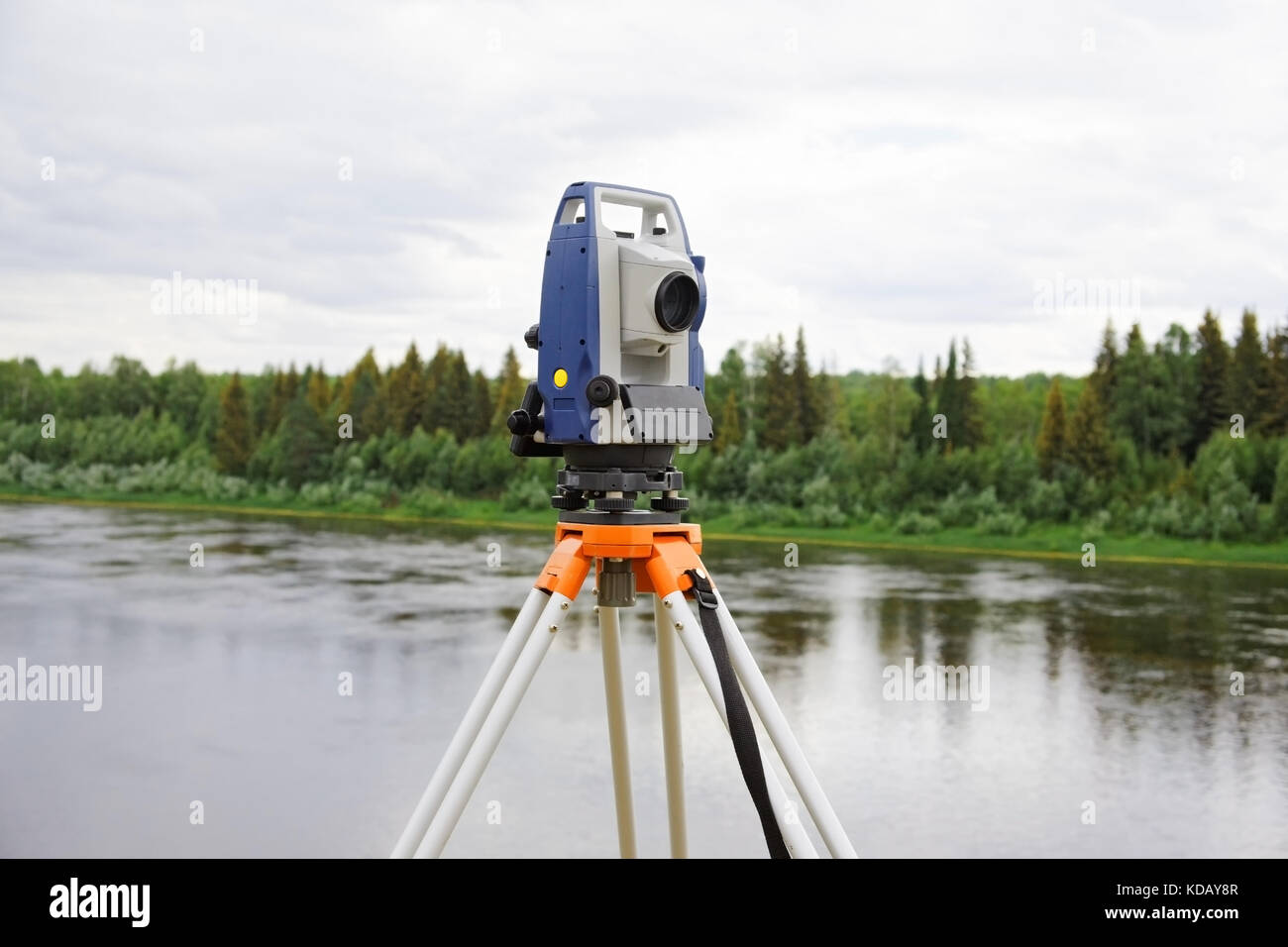 Modern electronic tachymeter mounted on tripod in field condition Stock ...