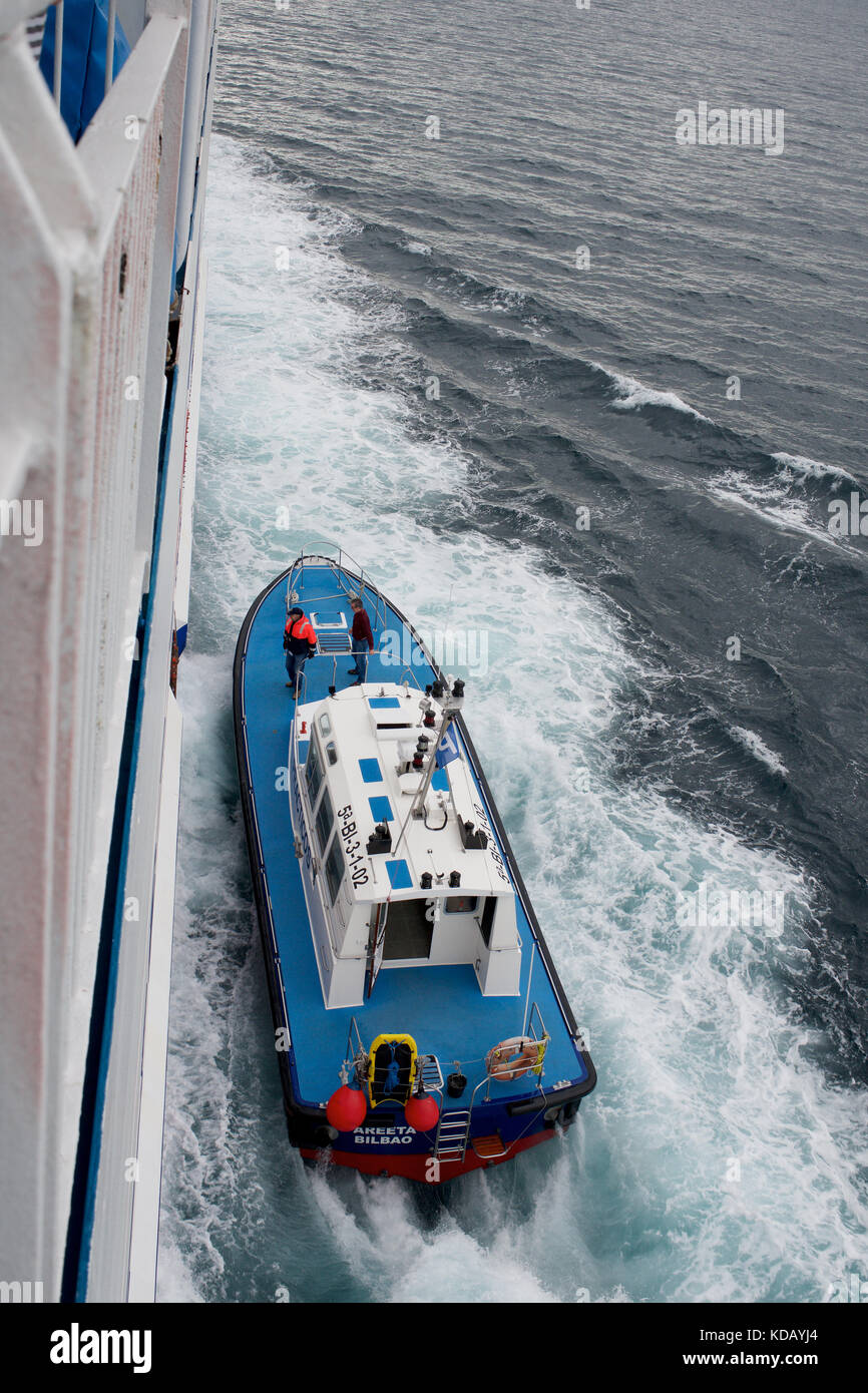 The Pilot boat comes alongside a ferry arriving at Bilbao, Spain Stock ...