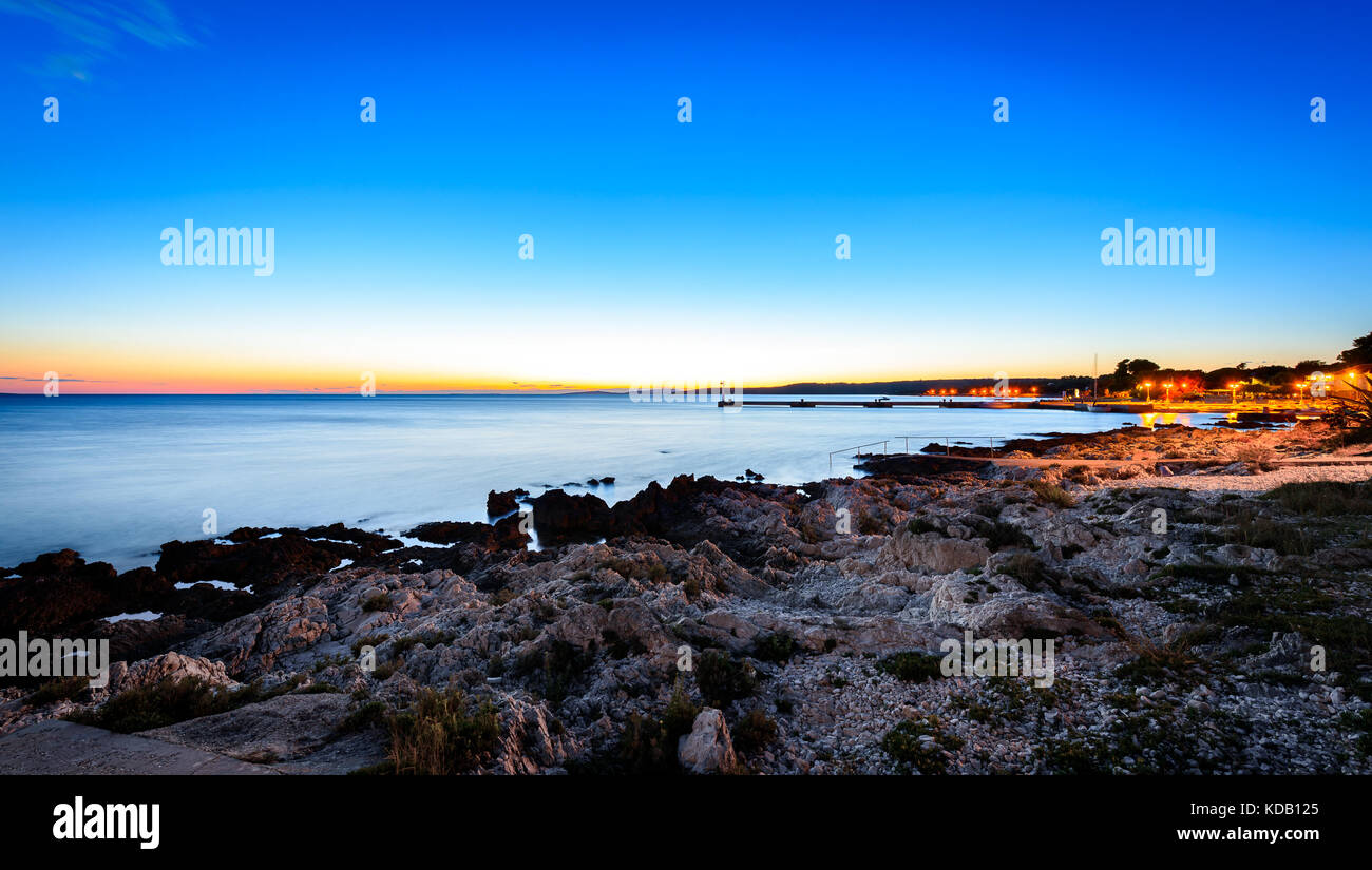 Sunset evening landscape photo of marine port of Silba Croatia. Long ...